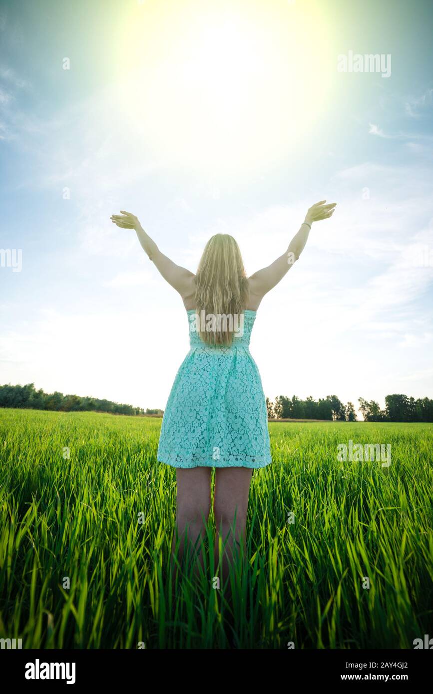 Happiness woman stay outdoor under sunlight of sunset Stock Photo - Alamy