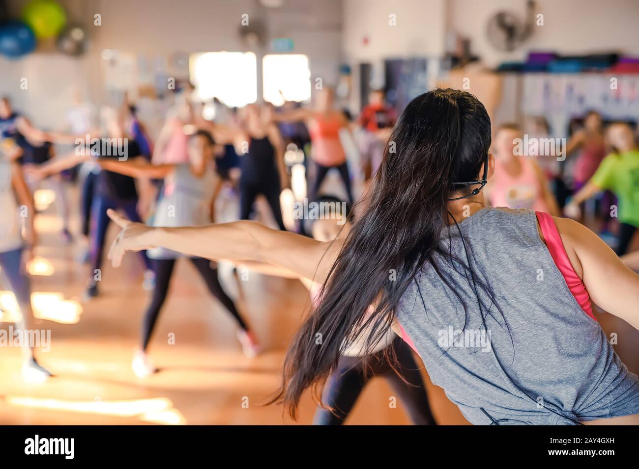 Blurred group of women in dancing aerobics class. Rear View of the ...