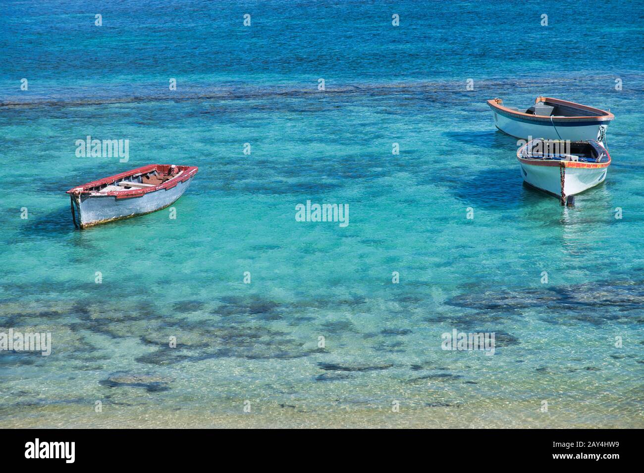 Beautiful small boats in shallow waters Stock Photo - Alamy