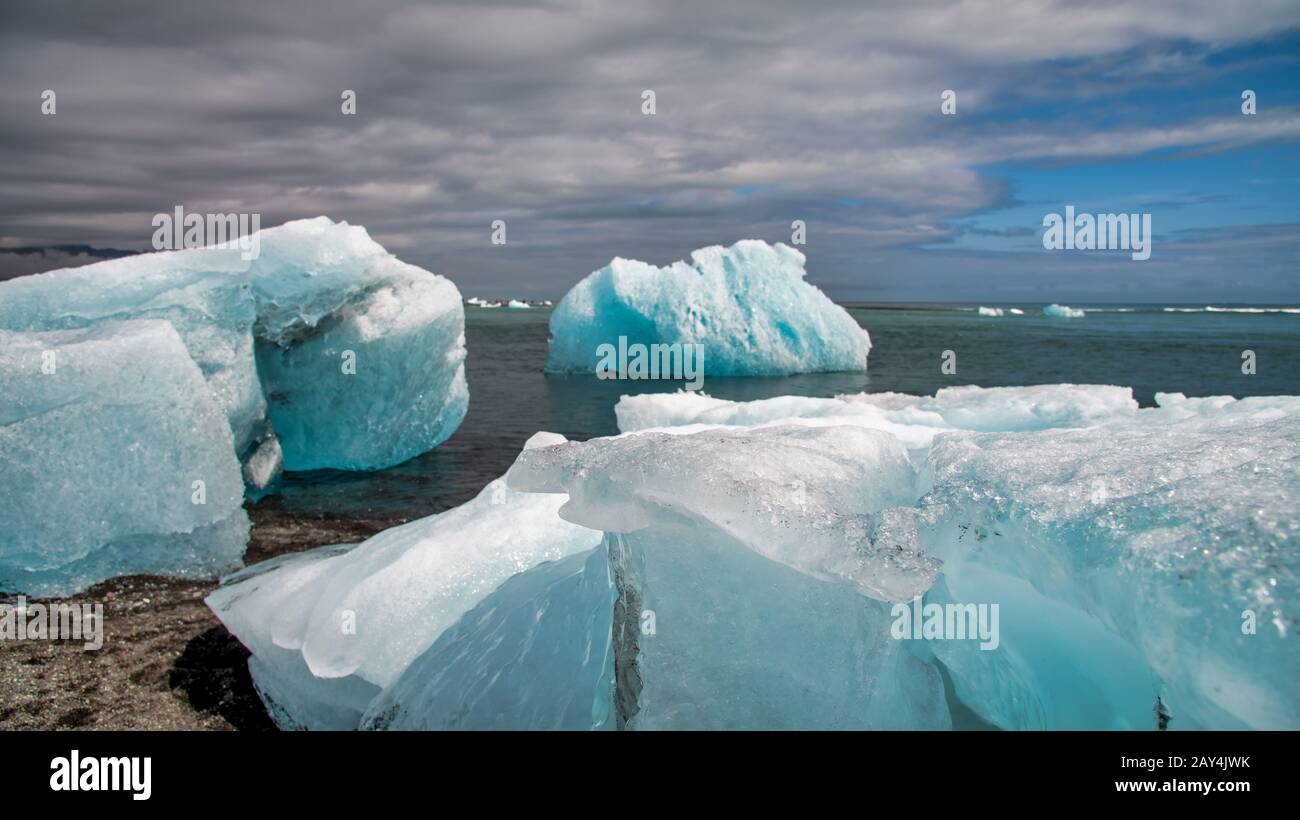 Landscape view of Jokullsarlon lagoon with floating ice, Iceland in ...