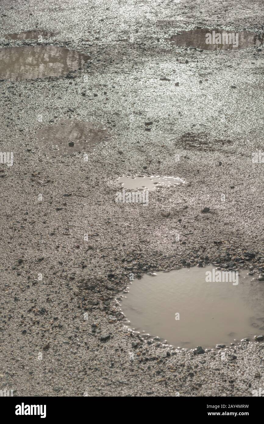 Pothole filled with rain water hi-res stock photography and images - Alamy
