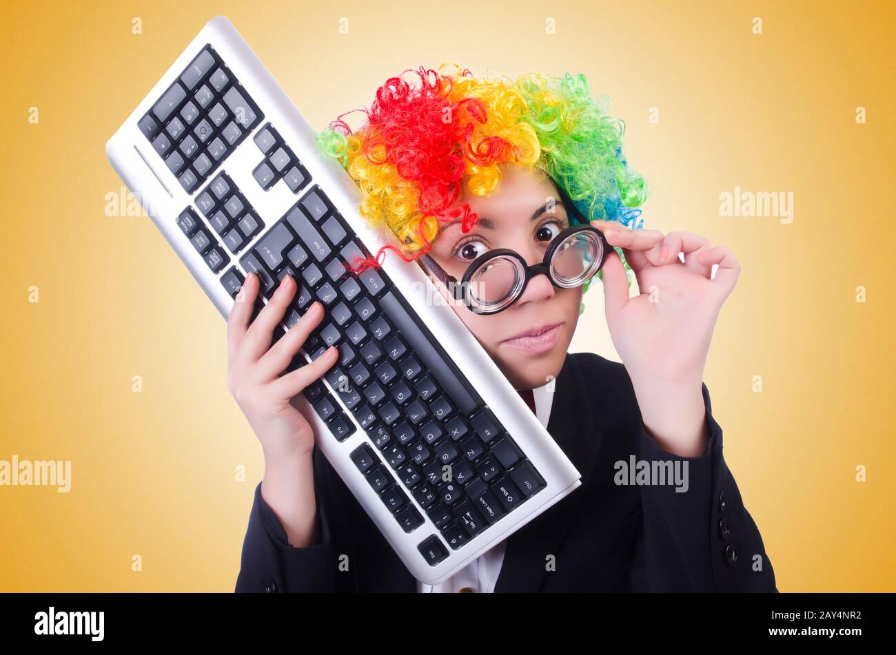 Funny clown with keyboard on white Stock Photo - Alamy
