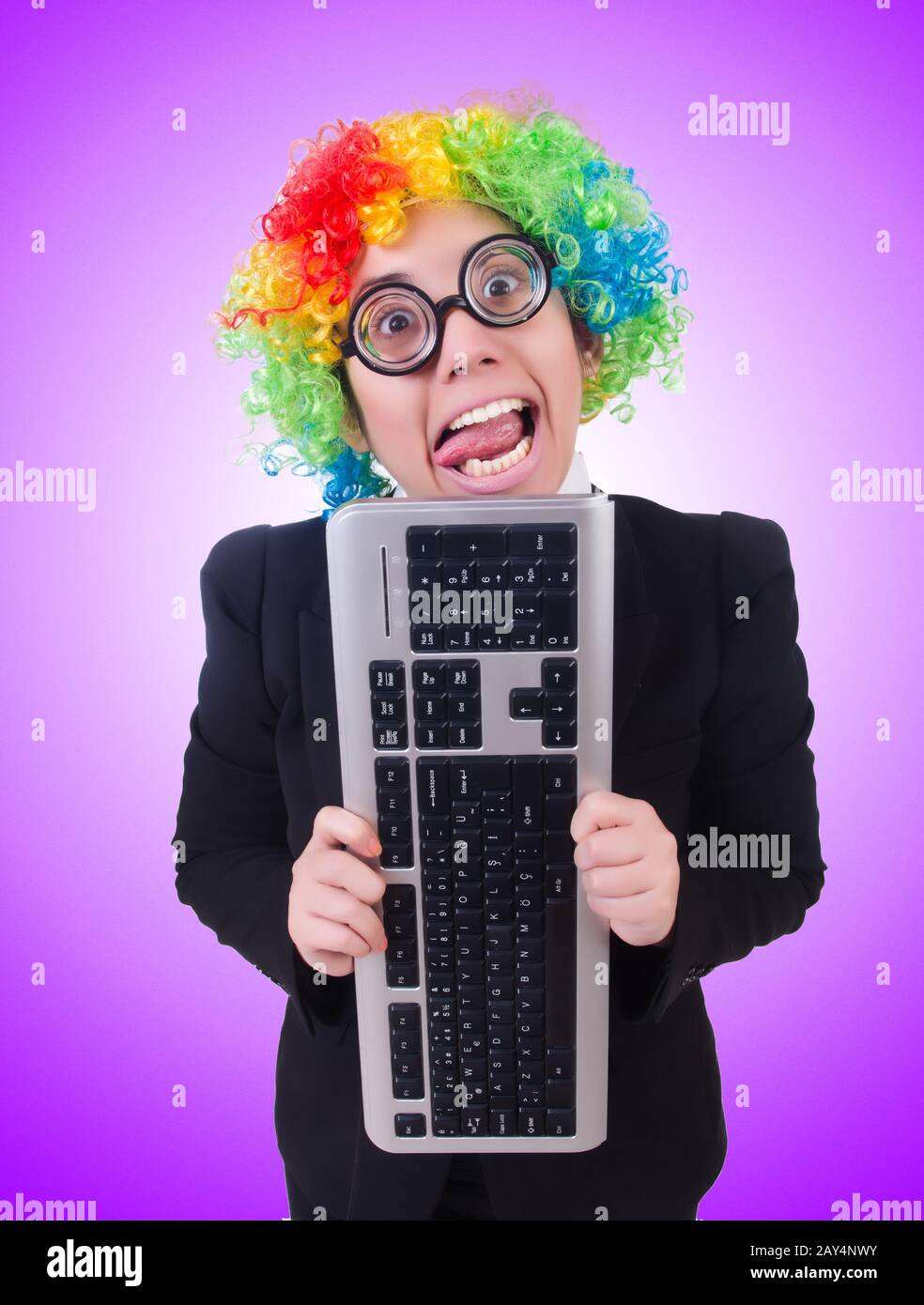 Funny clown with keyboard on white Stock Photo - Alamy