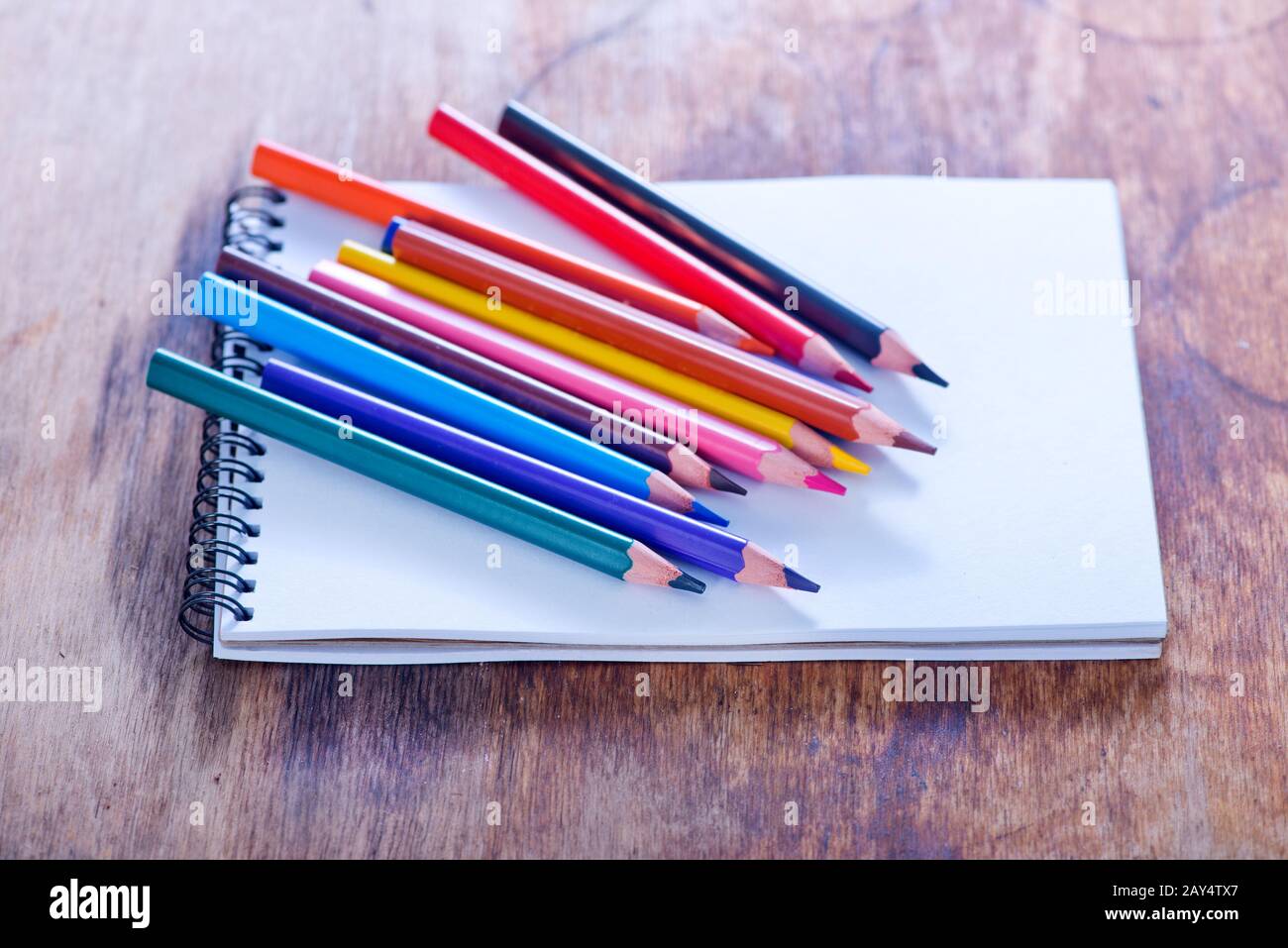 pencils and note Stock Photo - Alamy