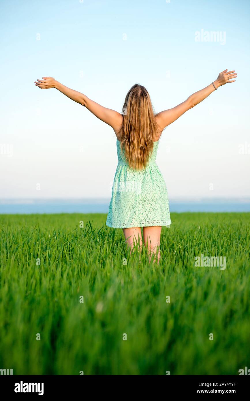 Happiness woman stay outdoor under sunlight of sunset Stock Photo - Alamy