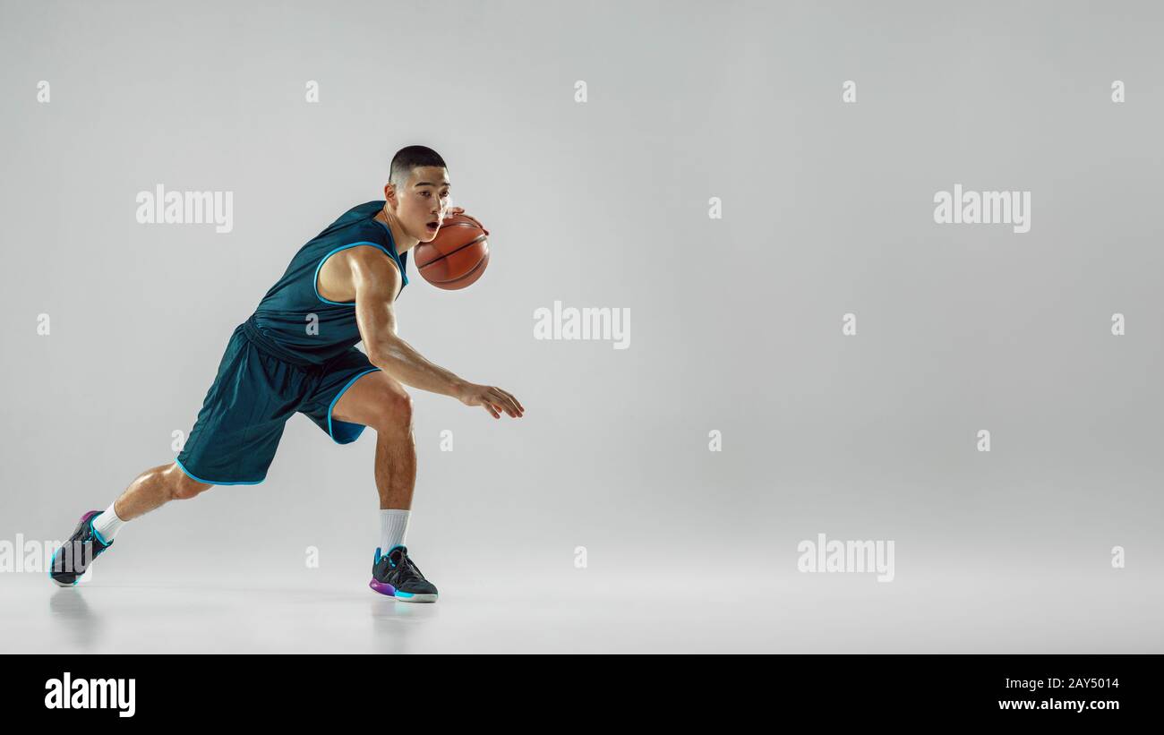 Young basketball player of team wearing sportwear training, practicing ...