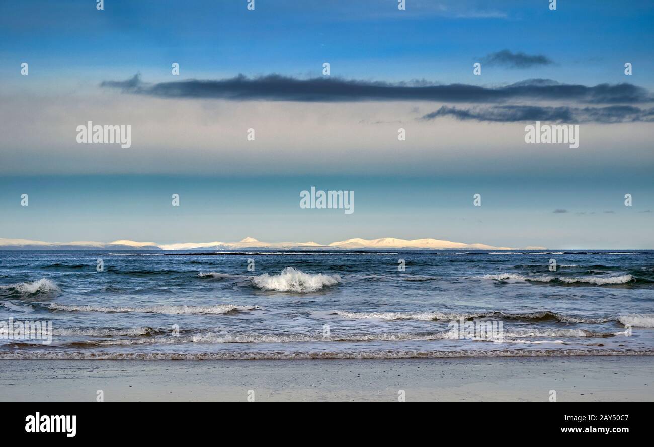 LOSSIEMOUTH MORAY FIRTH SCOTLAND A WINTER WEST BEACH AND WAVES WITH ...