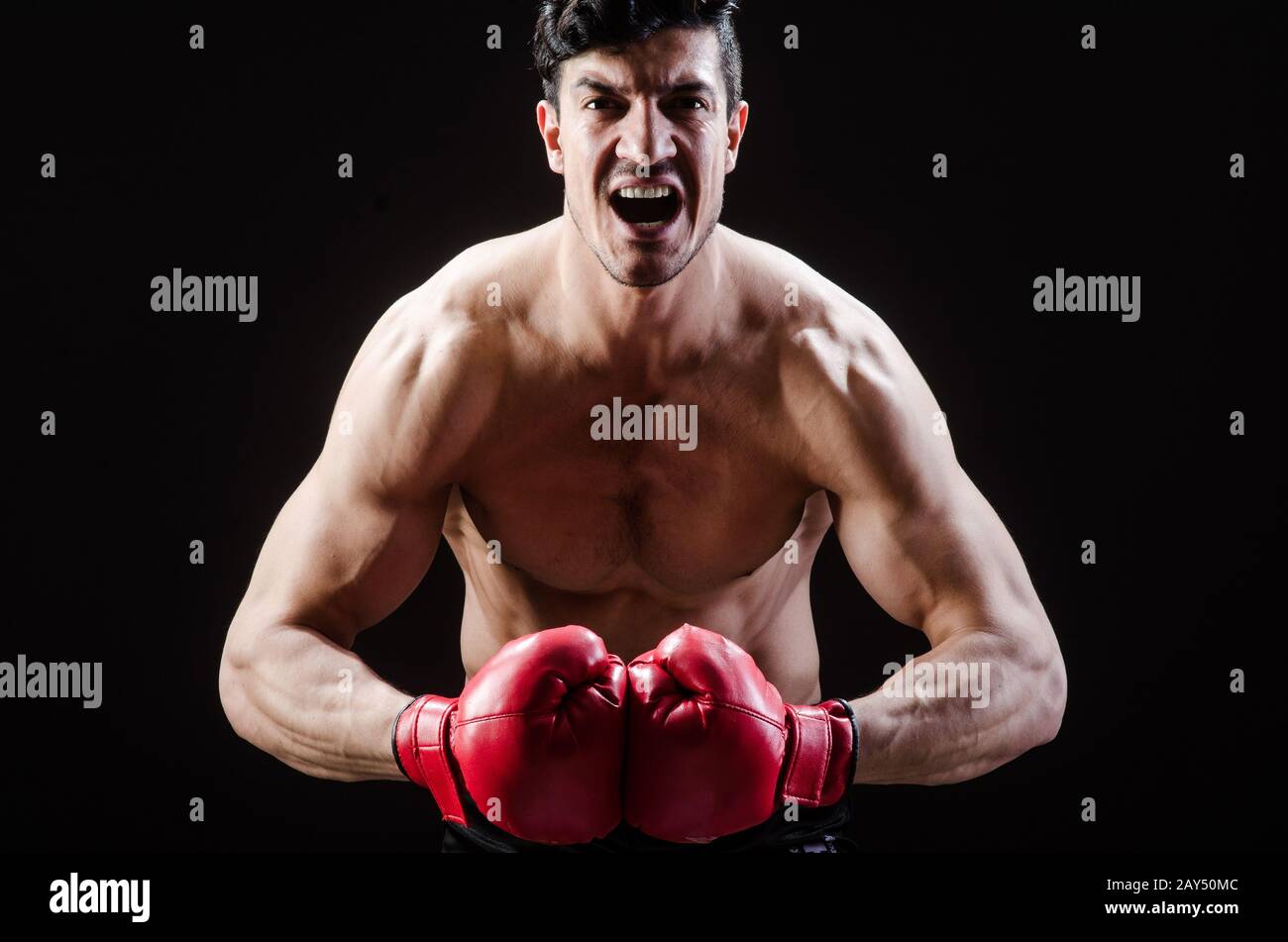 Muscular man in boxing concept Stock Photo - Alamy