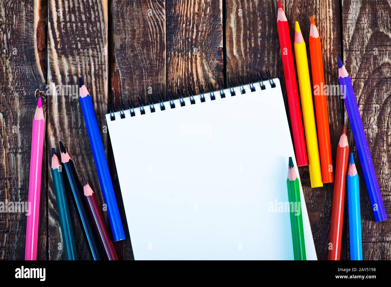 Note and pencils Stock Photo - Alamy