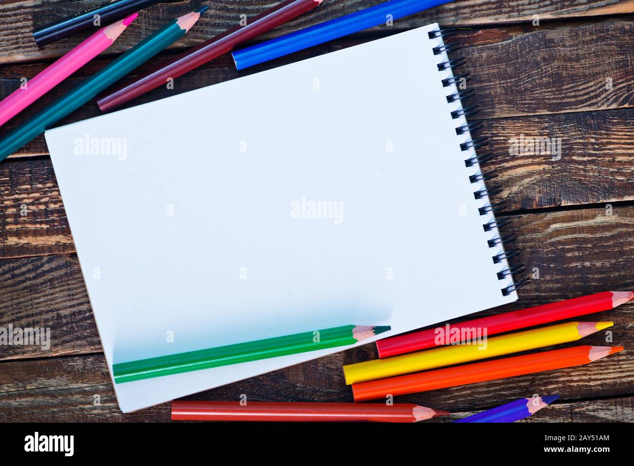 Note and pencils Stock Photo - Alamy