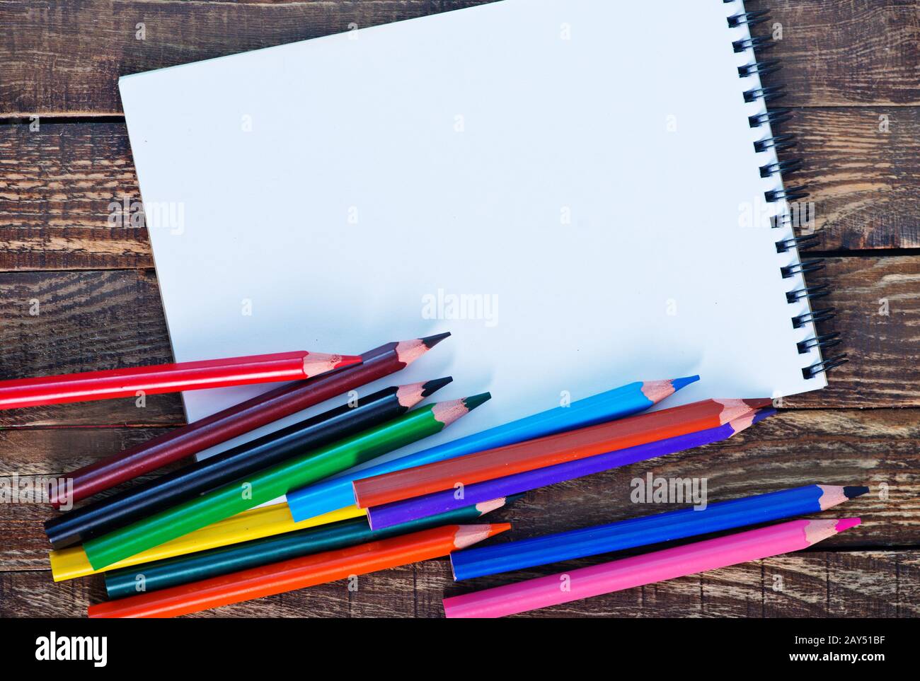 Note and pencils Stock Photo - Alamy