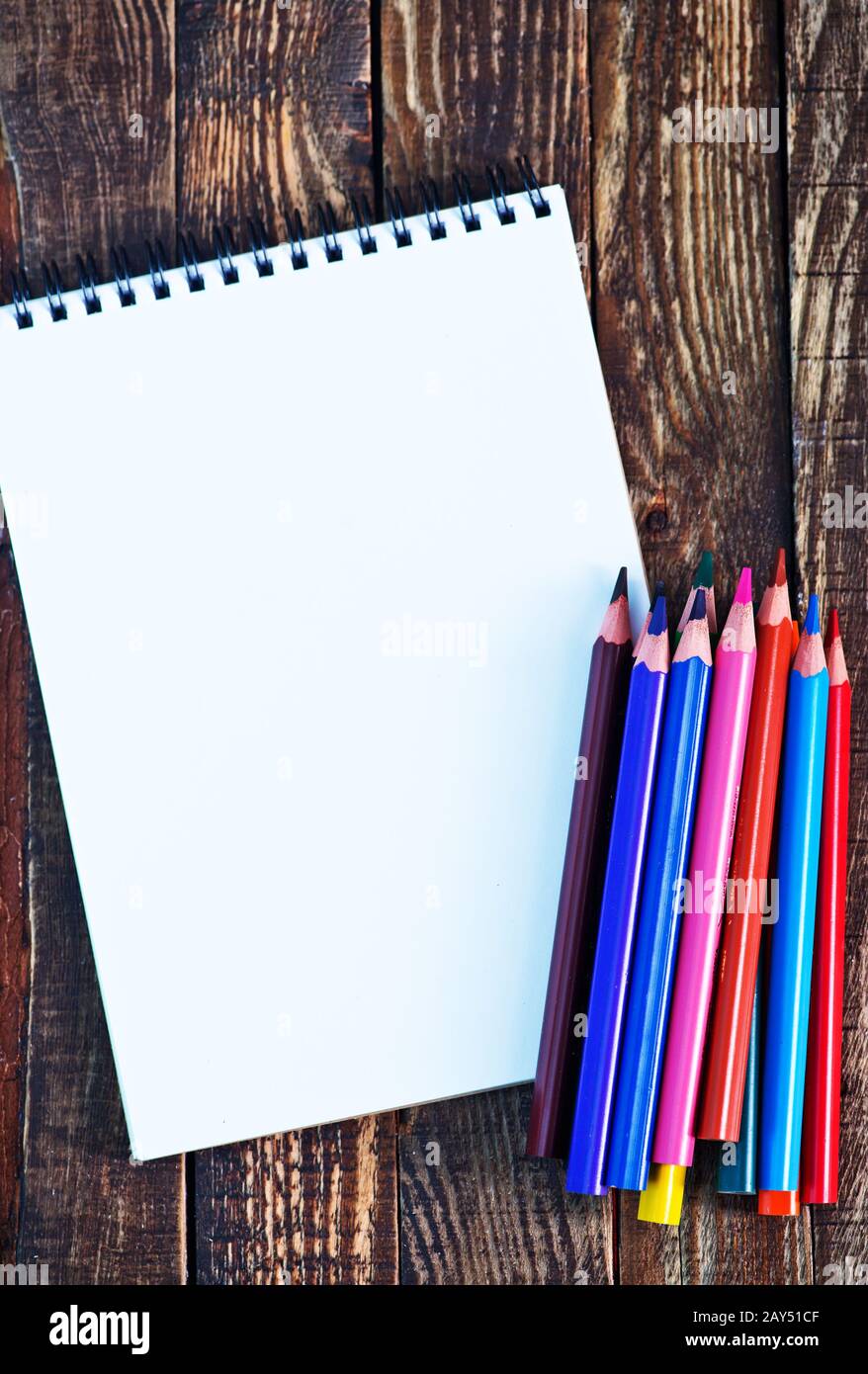 Note and pencils Stock Photo - Alamy