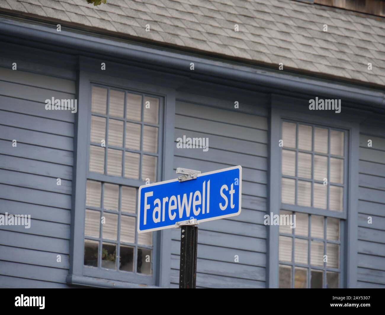 Windows of an old building with a sign of Farewell Street in Newport ...