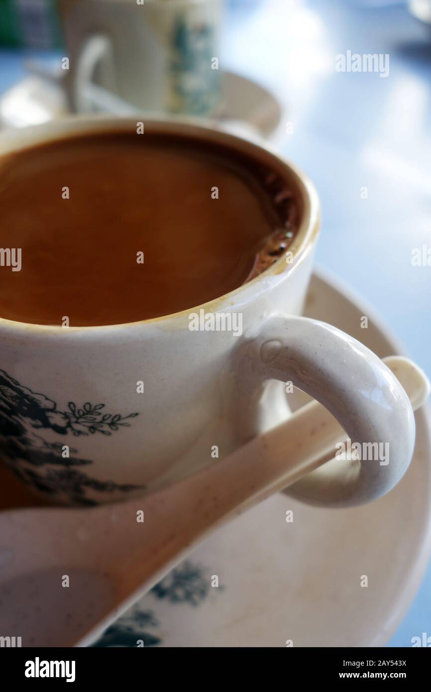 Traditional oriental Chinese coffee in vintage mug and saucer Stock ...