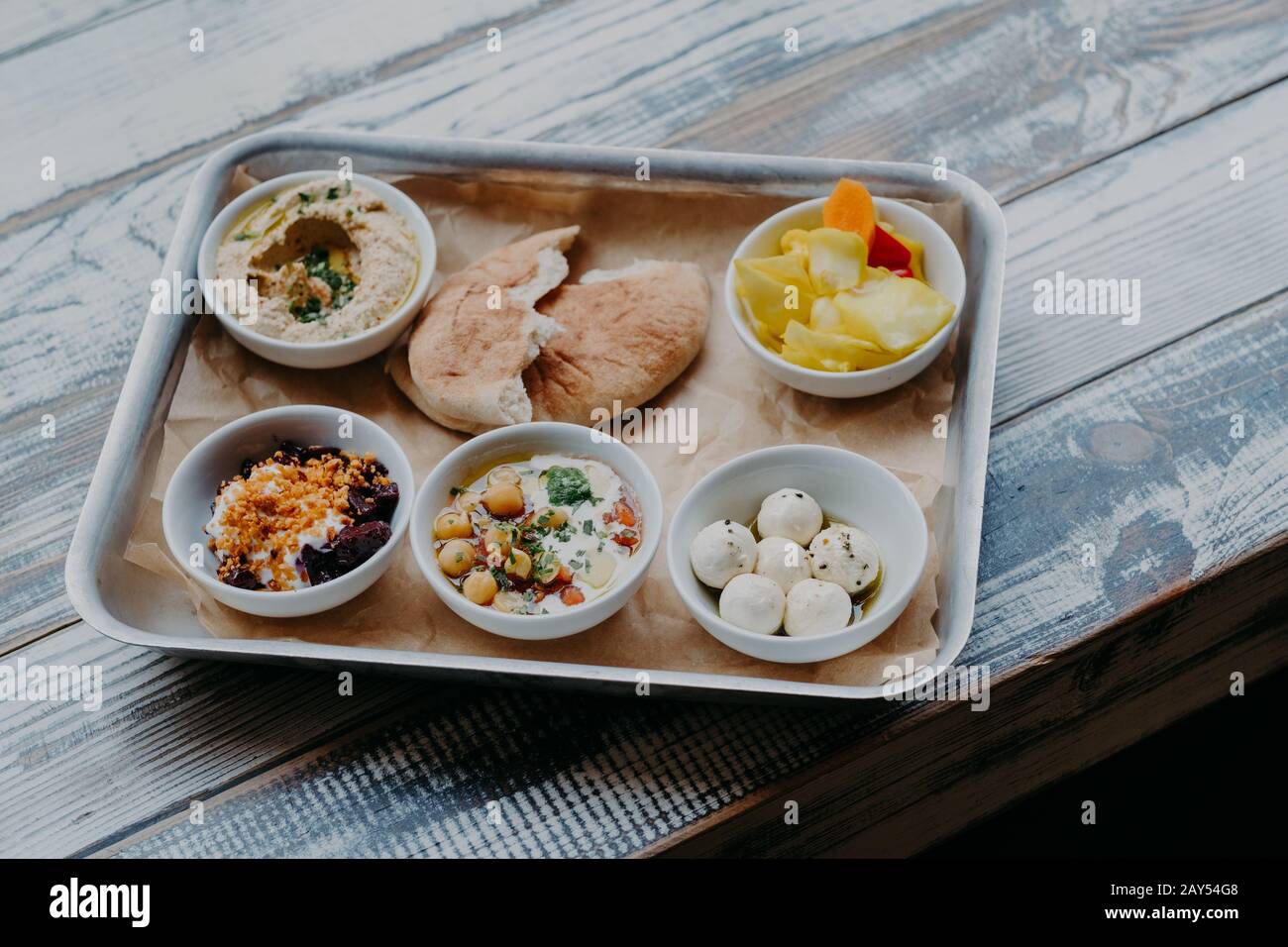 Traditional Israel food concept. Bowl of exotic dish on tray. Hummus ...