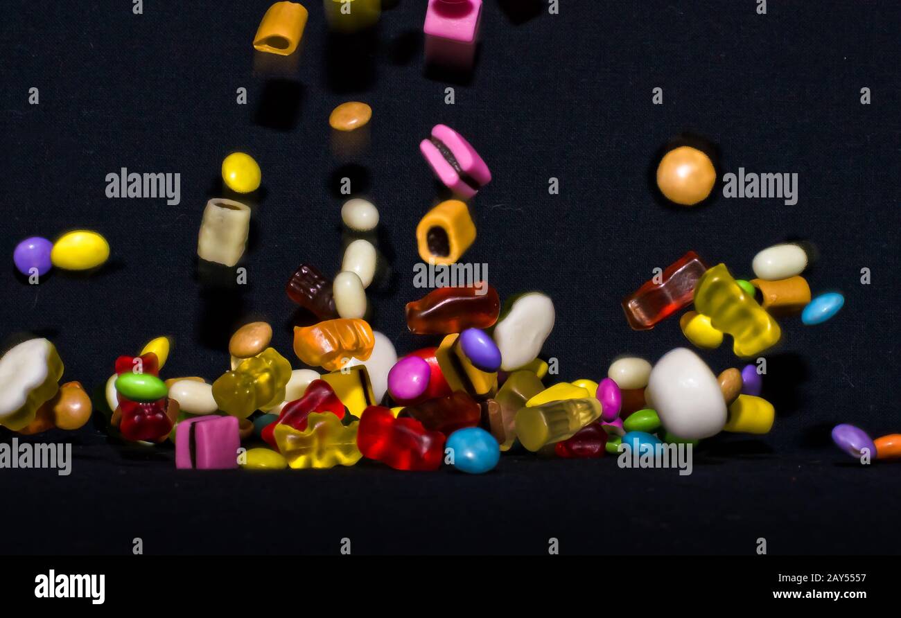 Candies falling down hi-res stock photography and images - Alamy