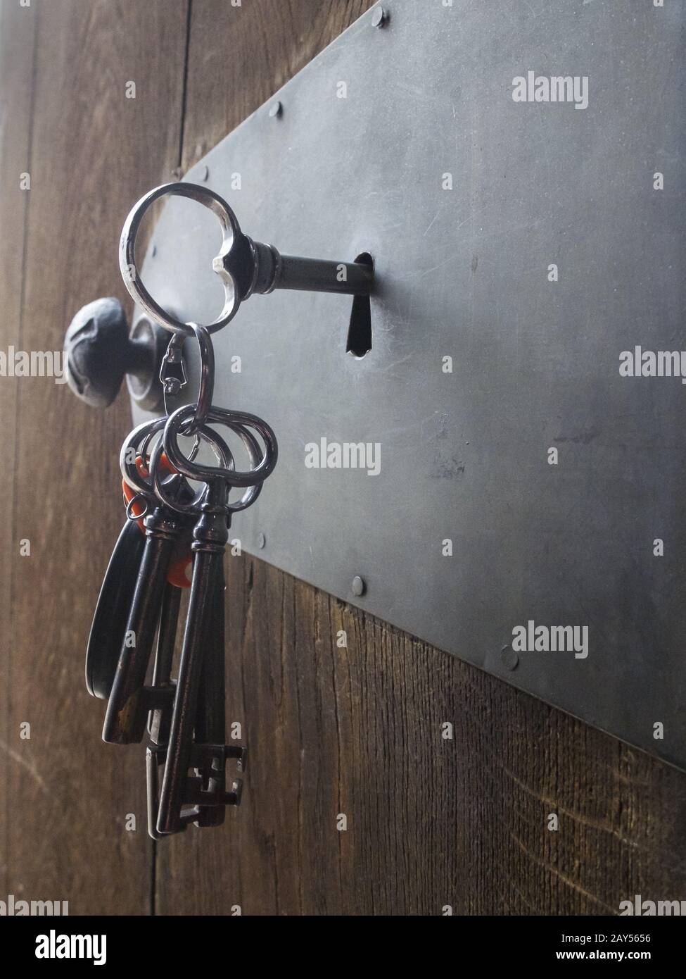 old keys in a door lock Stock Photo - Alamy