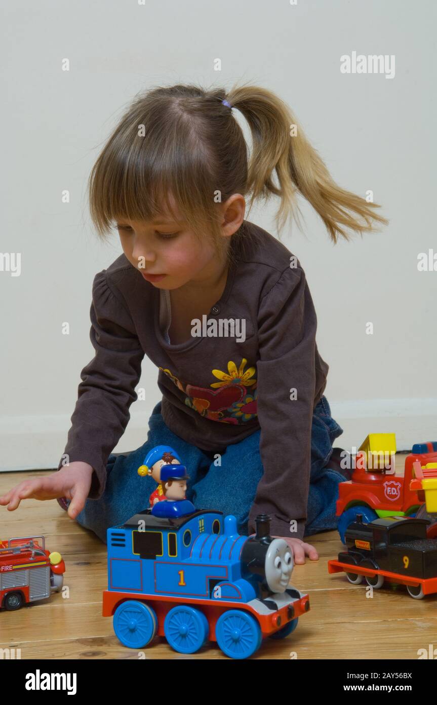 Girl playing with cars hi-res stock photography and images - Alamy