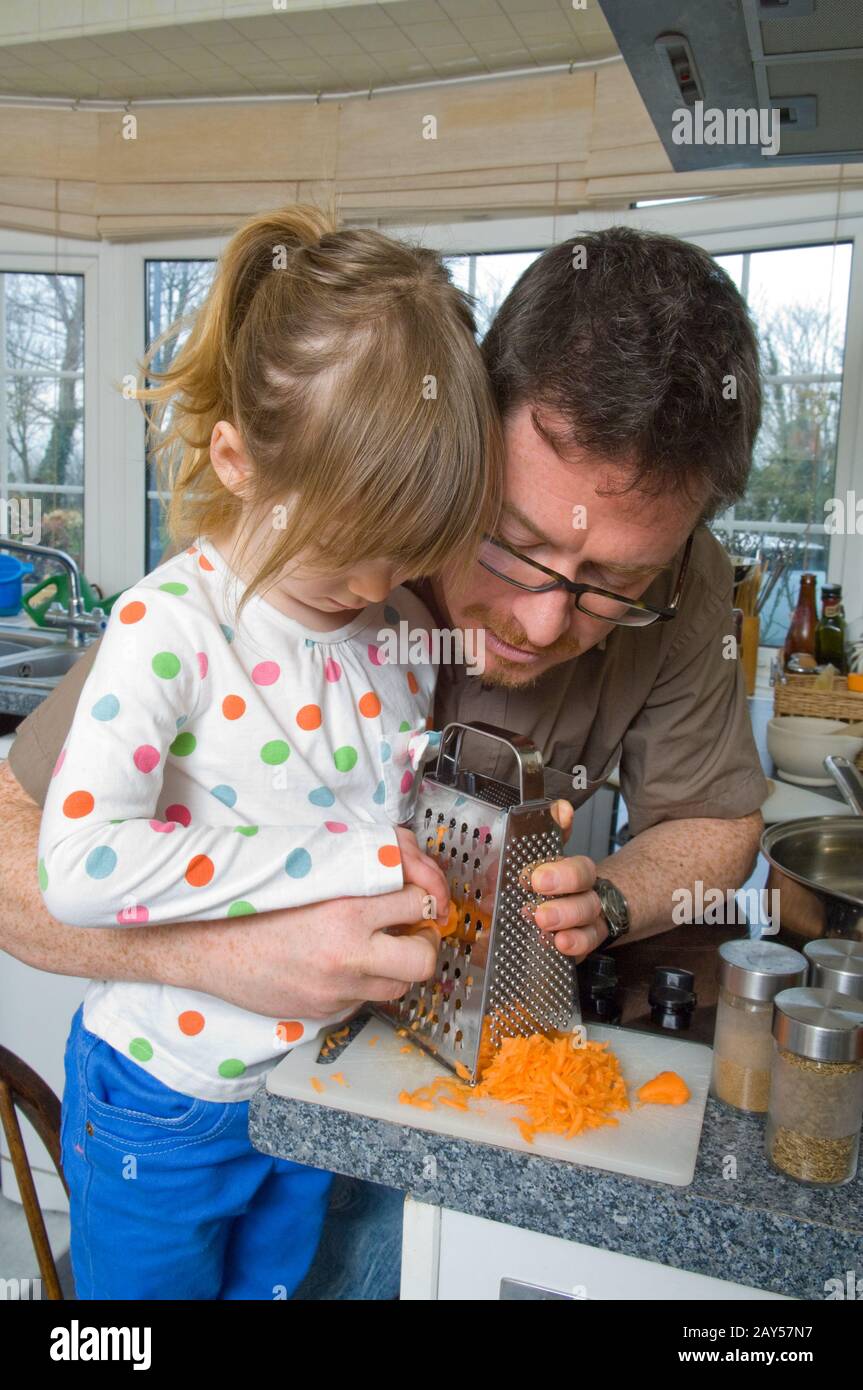 father and daughter cooking together Stock Photo - Alamy