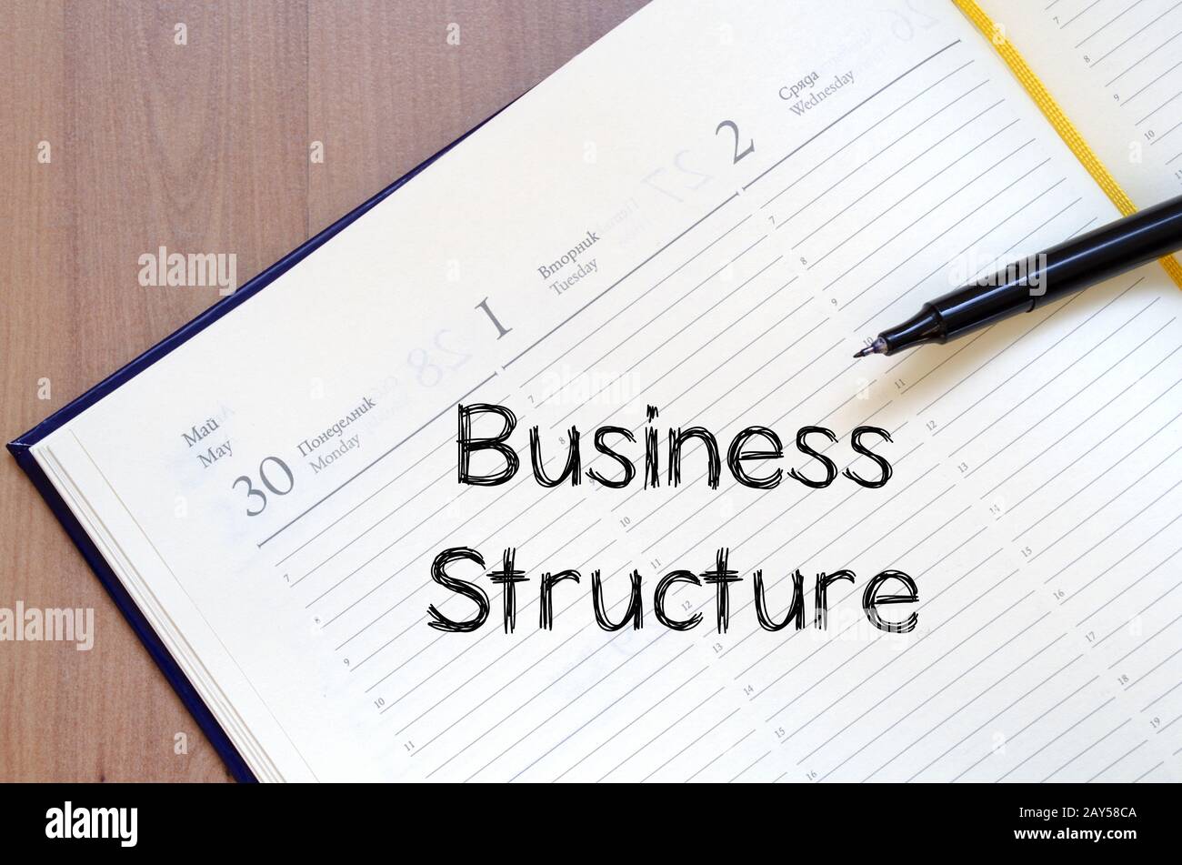 Business structure write on notebook Stock Photo - Alamy