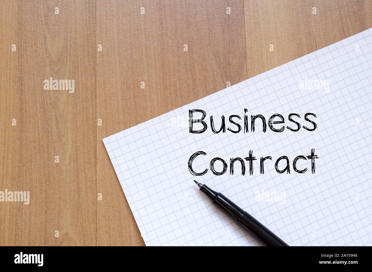Business contract write on notebook Stock Photo - Alamy