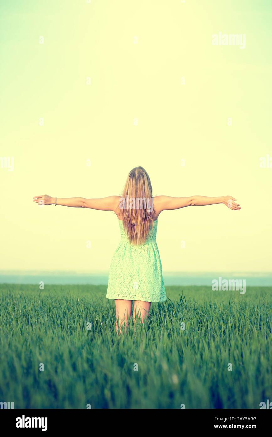 Happiness woman stay outdoor under sunlight of sunset Stock Photo - Alamy