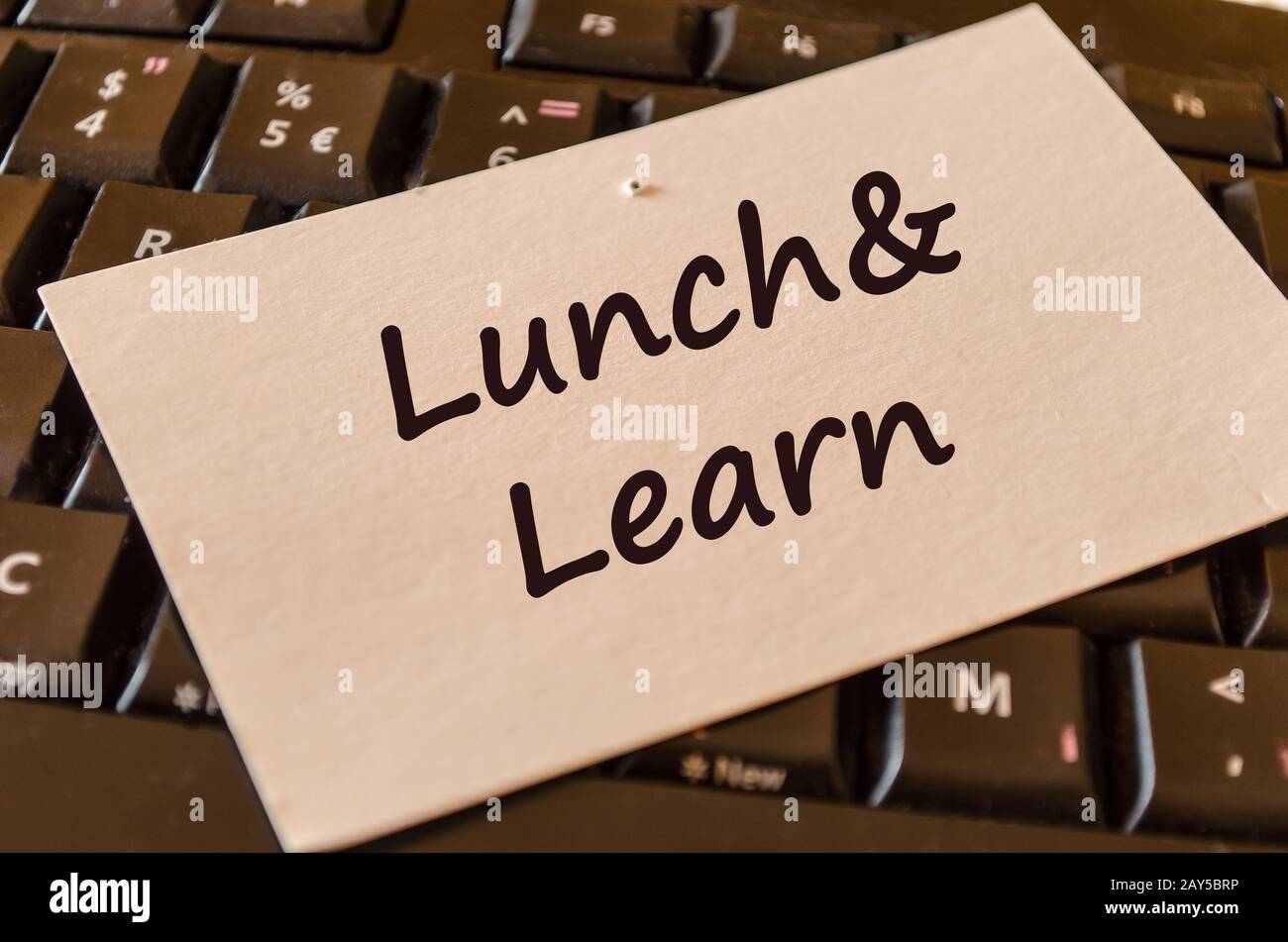 Lunch and learn text note Stock Photo - Alamy