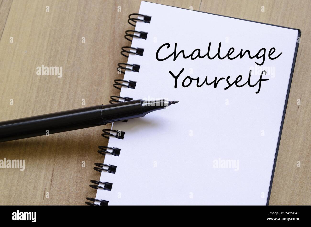 Challenge yourself write on notebook Stock Photo - Alamy