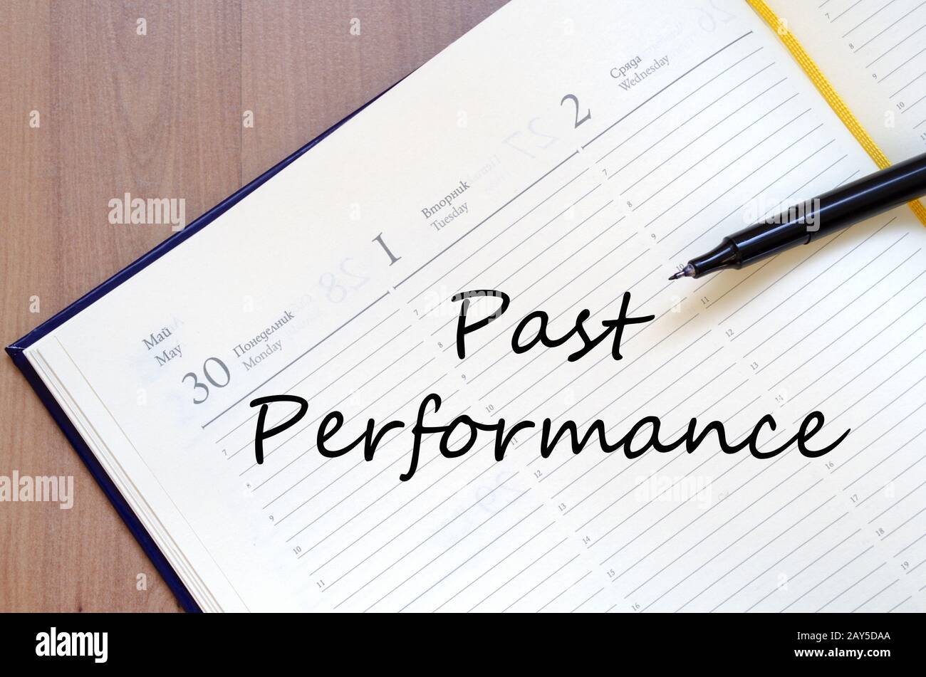 Past performance write on notebook Stock Photo - Alamy