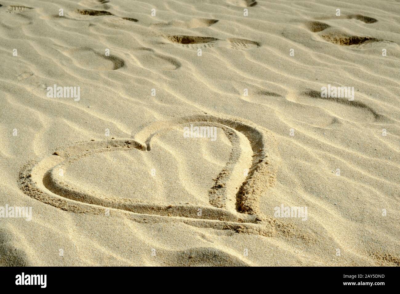 Love is in the sand Stock Photo - Alamy