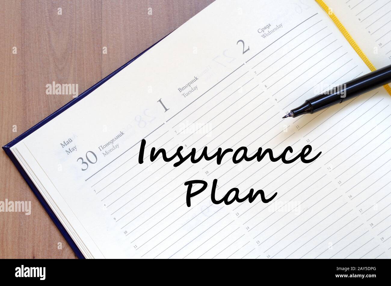 Insurance plan write on notebook Stock Photo - Alamy