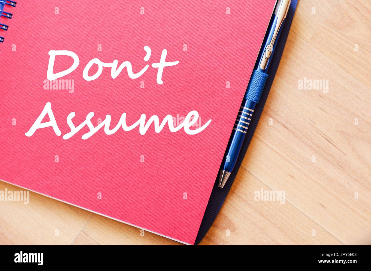 Don't assume write on notebook Stock Photo - Alamy