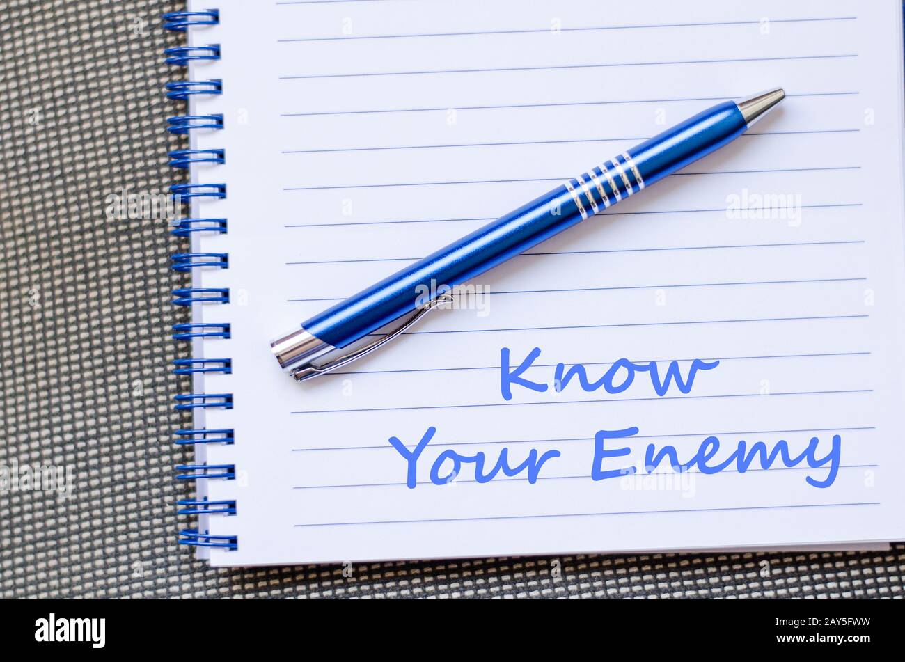 Know your enemy write on notebook Stock Photo - Alamy