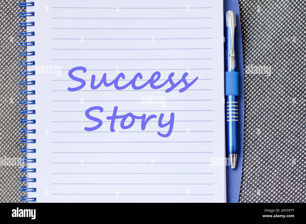 Success story write on notebook Stock Photo - Alamy