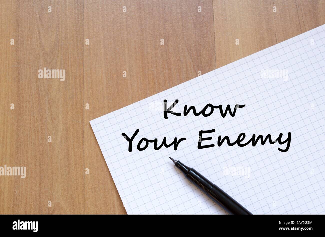 Know your enemy write on notebook Stock Photo - Alamy