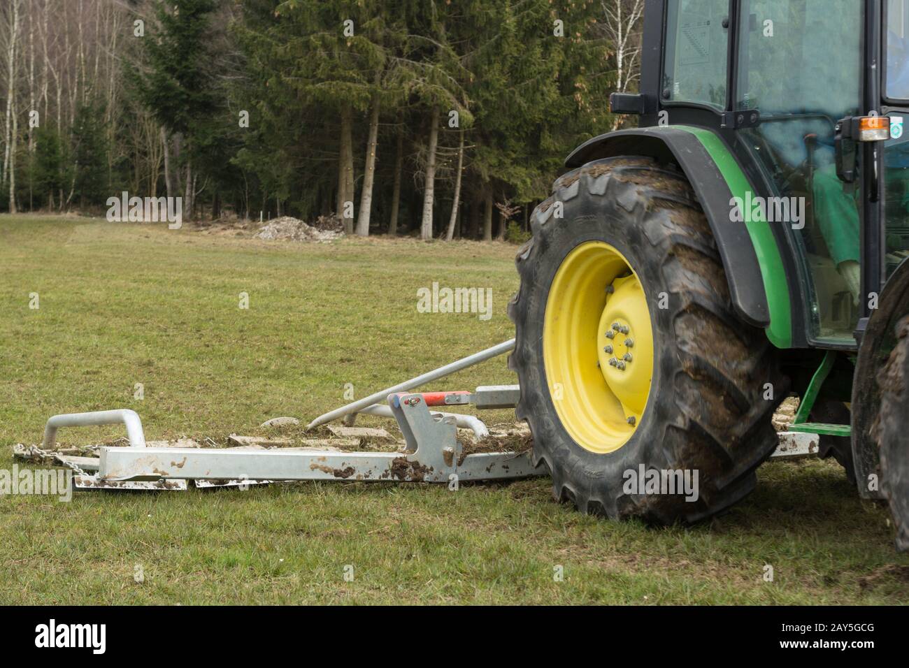 Harrow with section of tractor - Landscape conservation Stock Photo - Alamy