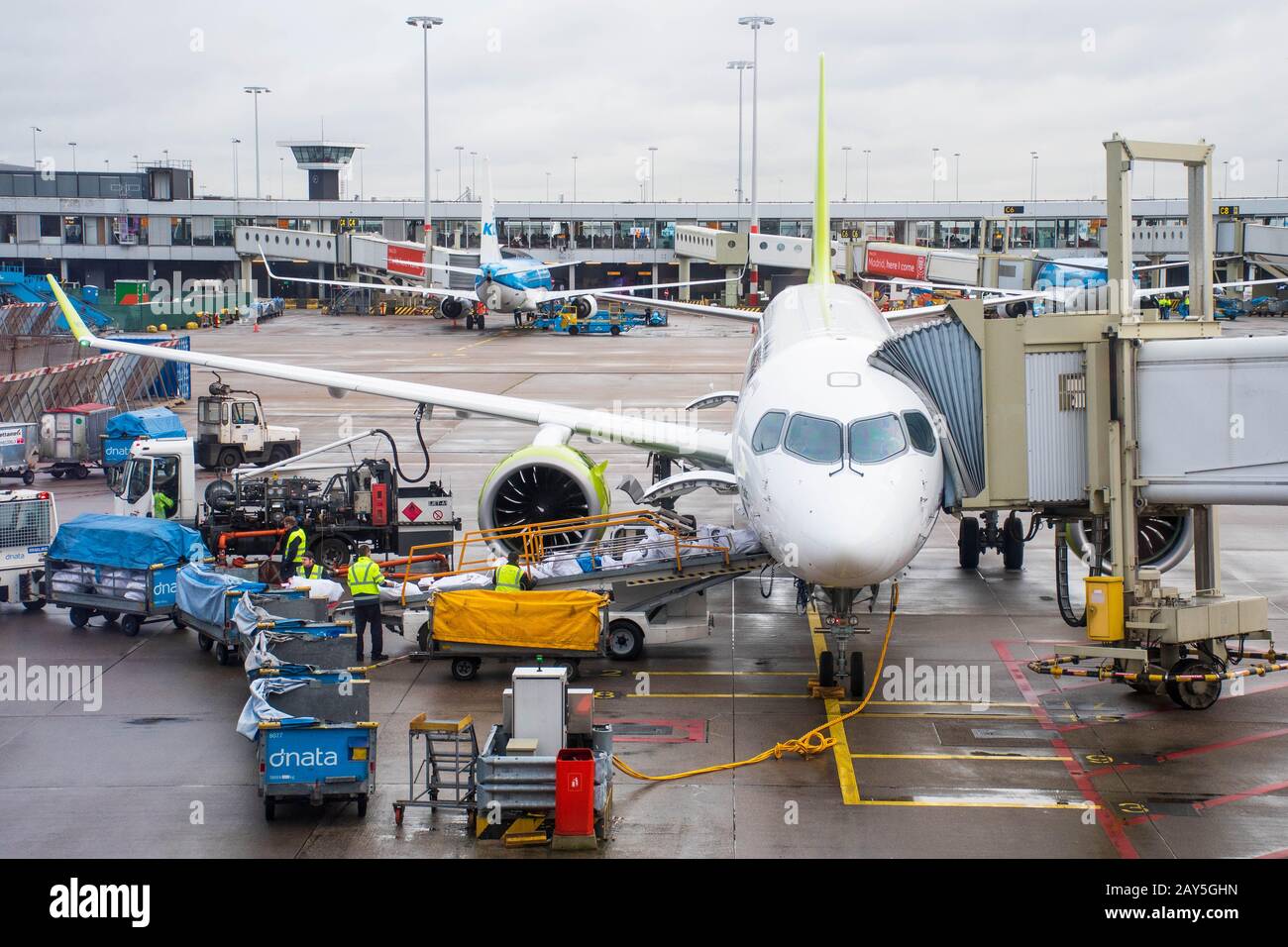 Airplanes parked at the airport. Handling and preparing for the flight ...