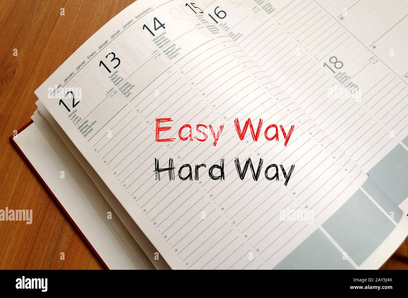 Easy way hard way write on notebook Stock Photo - Alamy