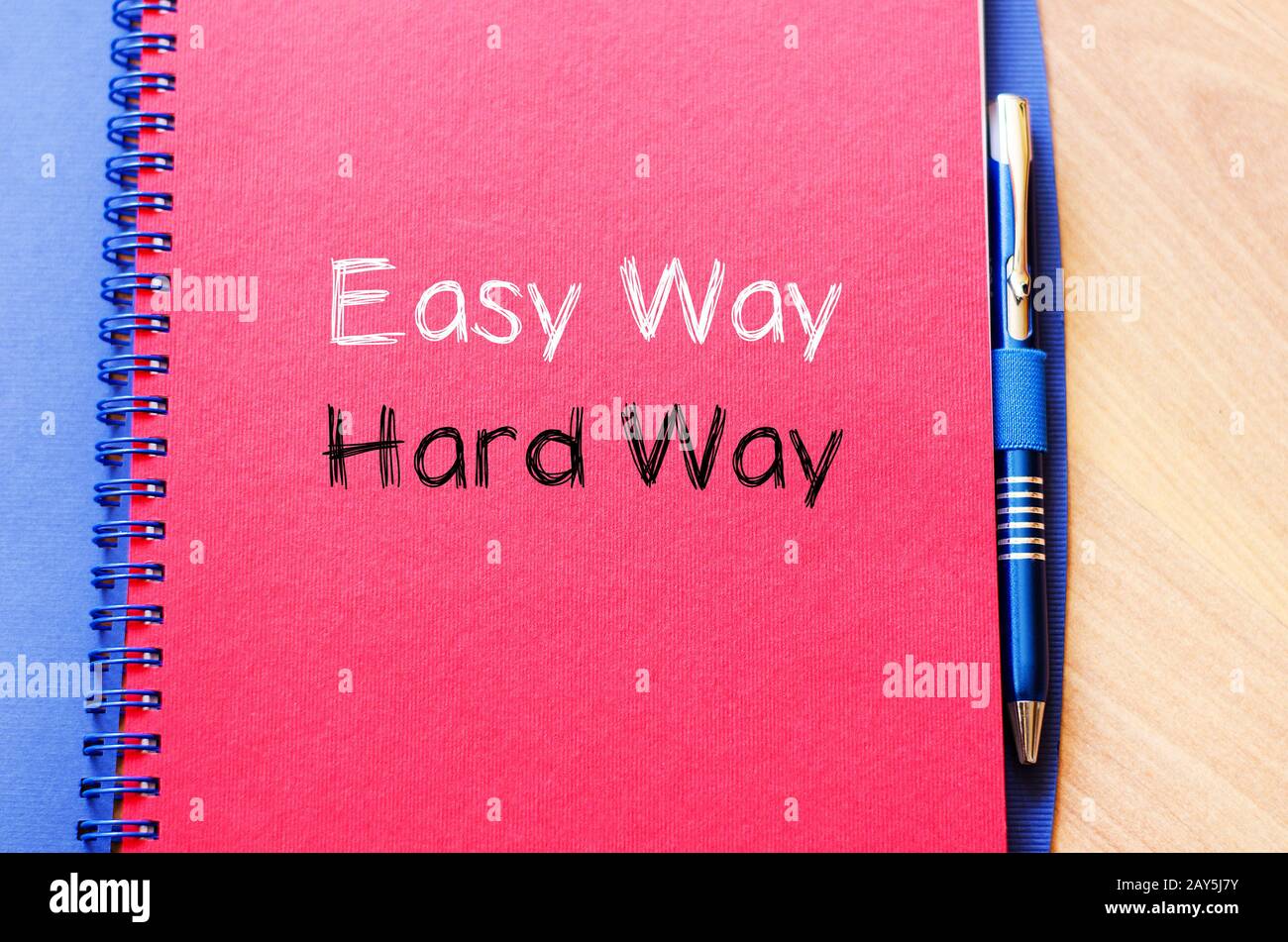 Easy way hard way write on notebook Stock Photo - Alamy