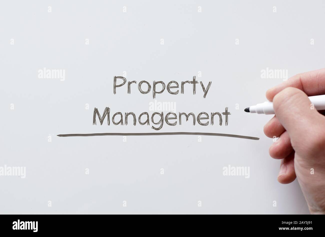 Property management written on whiteboard Stock Photo - Alamy