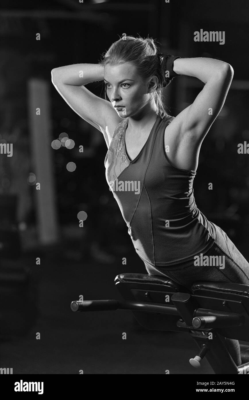 Woman doing strength exercises for abs muscles Stock Photo - Alamy