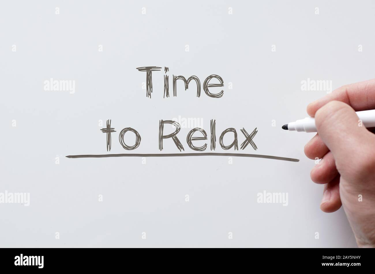 Time to relax written on whiteboard Stock Photo - Alamy