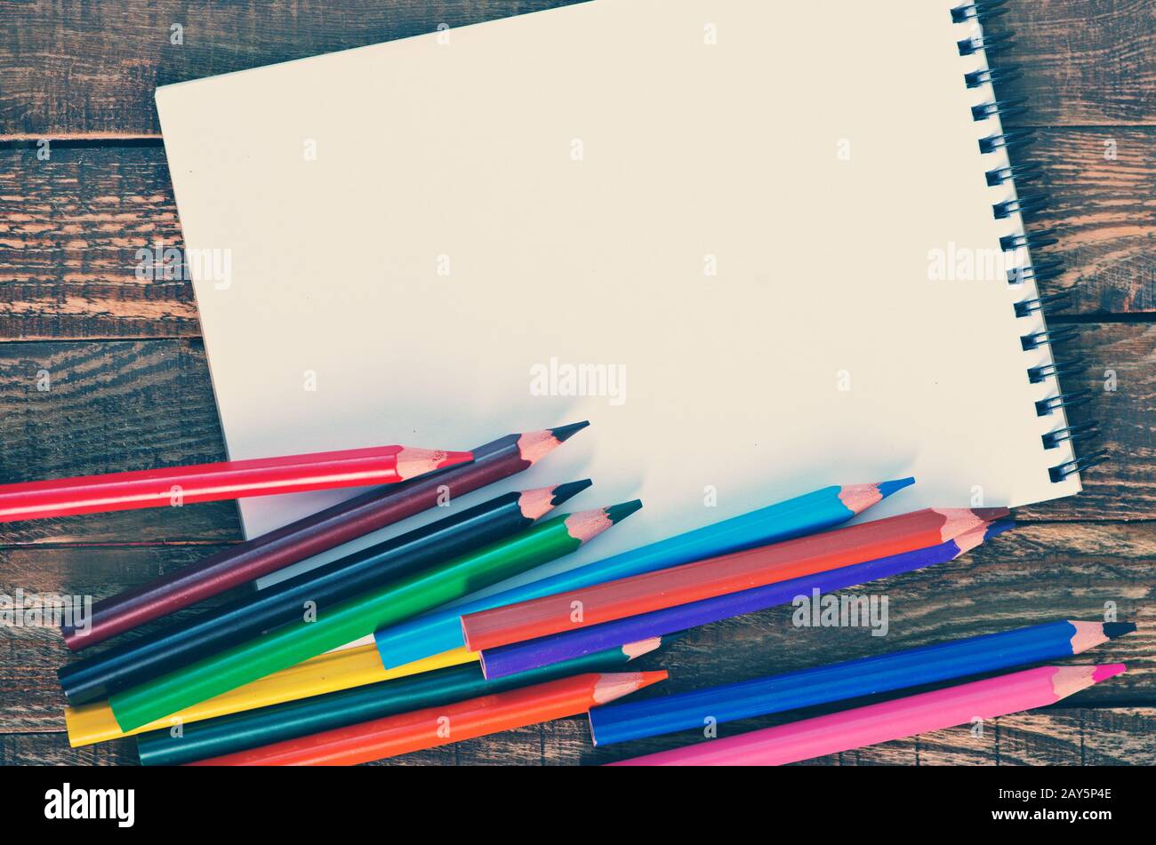 Note and pencils Stock Photo - Alamy