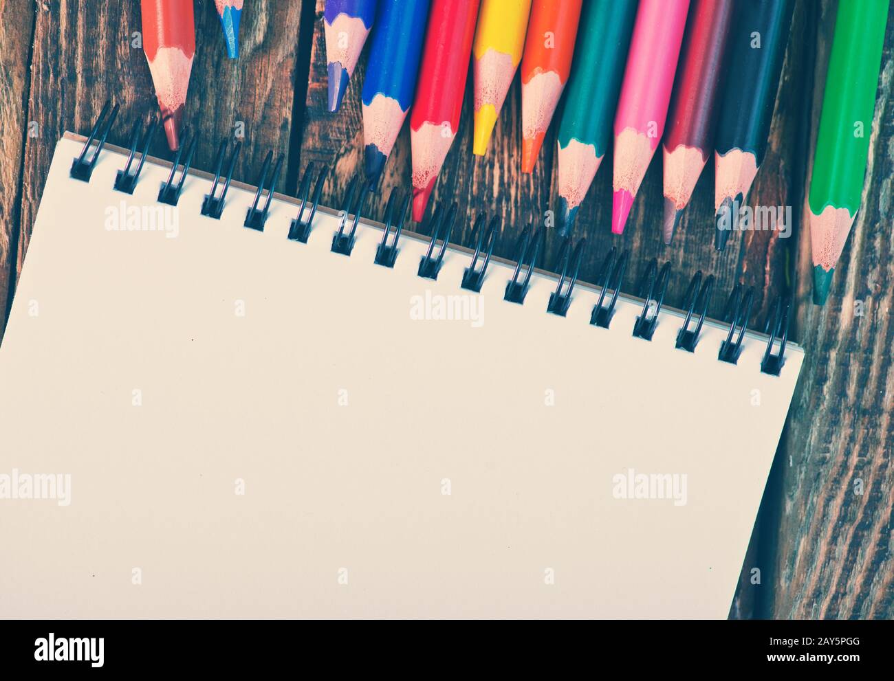 Note and pencils Stock Photo - Alamy
