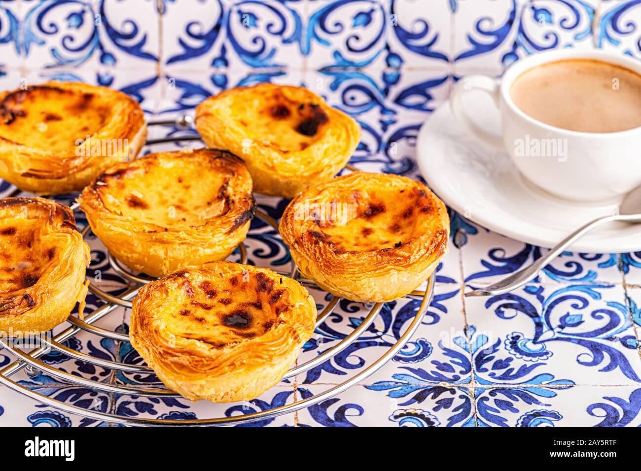 Egg tart, traditional Portuguese dessert, pastel de nata. Azulejo tile ...