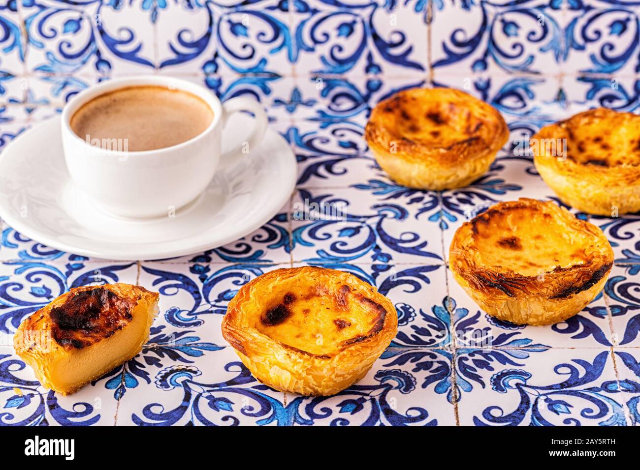 Egg tart, traditional Portuguese dessert, pastel de nata. Azulejo tile ...