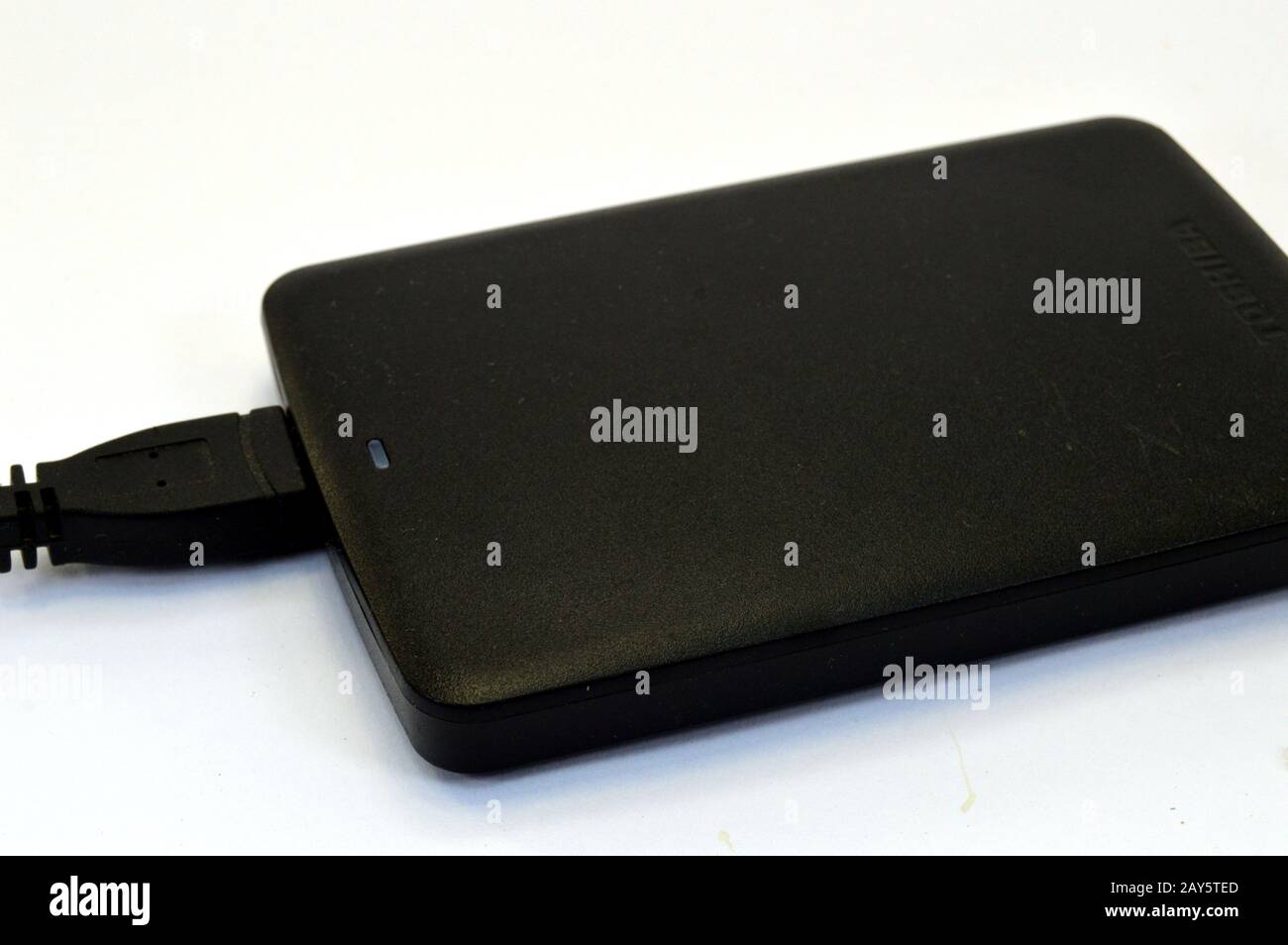 External hard disk of a black tetra of color Stock Photo - Alamy