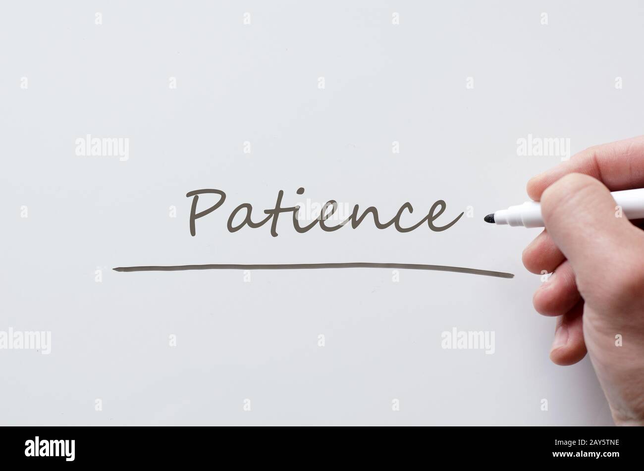 Patience written on whiteboard Stock Photo - Alamy
