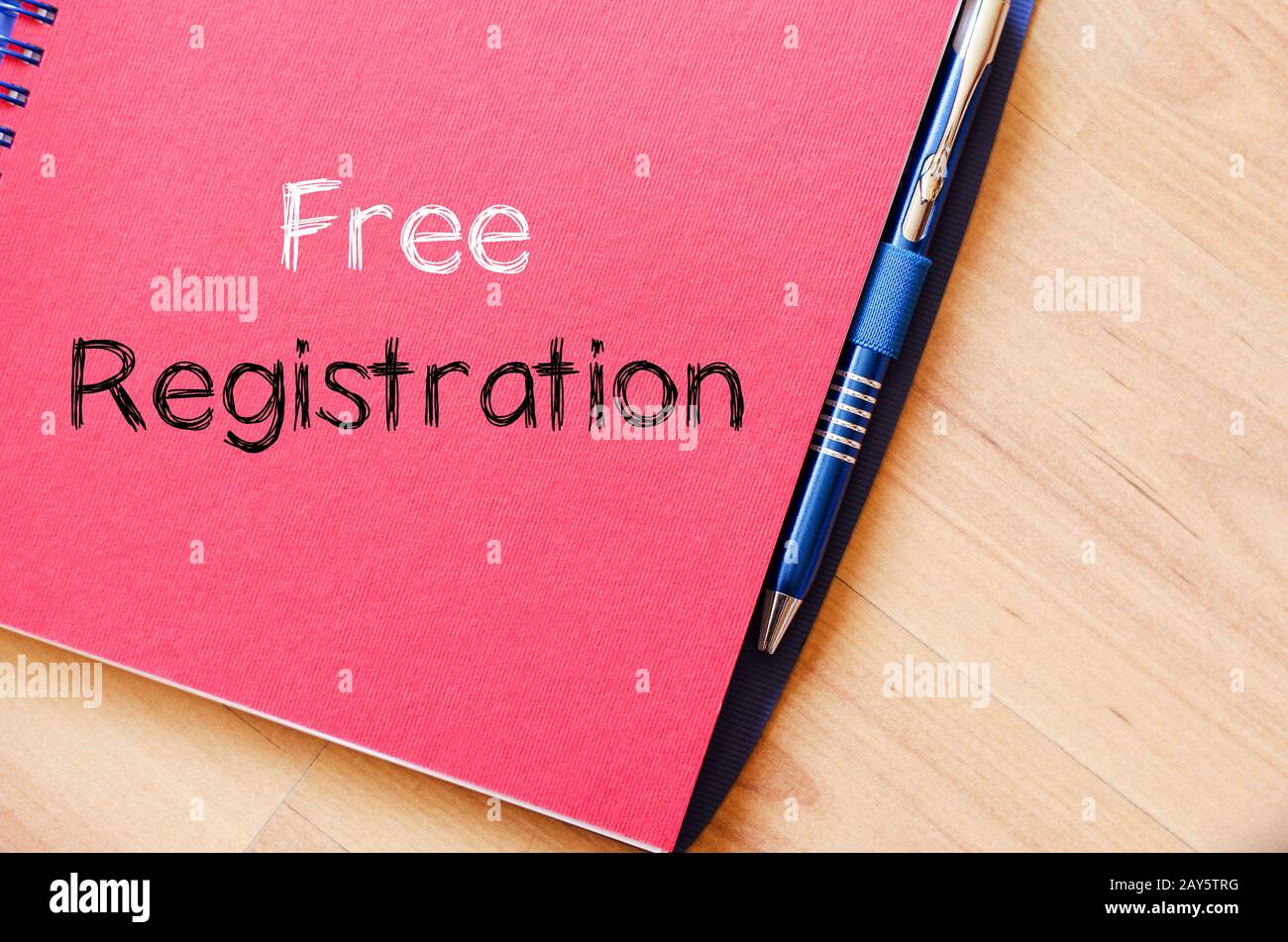 Free registration write on notebook Stock Photo - Alamy