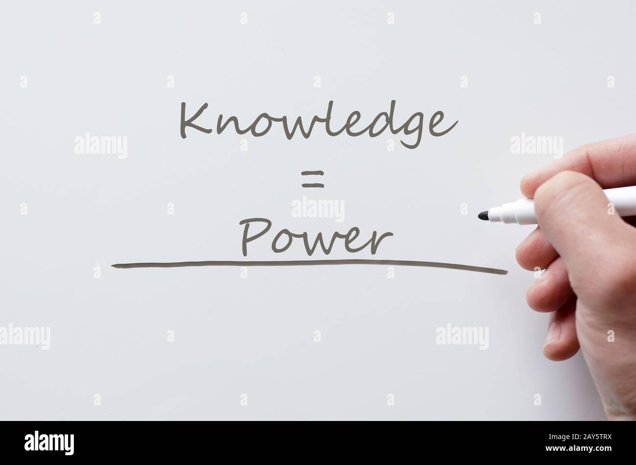 Knowledge and power written on whiteboard Stock Photo - Alamy